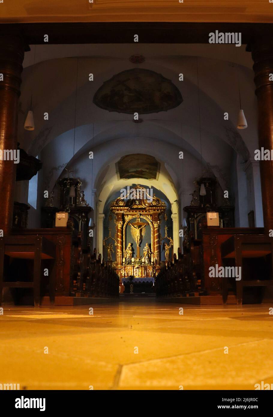 Aisle between pews leading to an altar at the front of the Kreuzberg ...