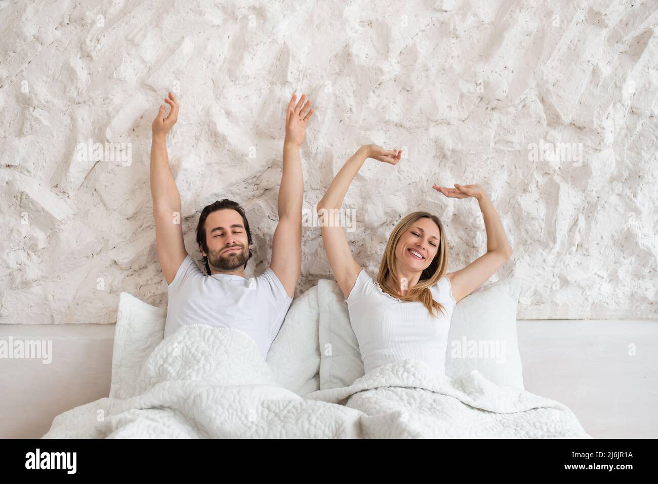 Loving couple waking up together hi-res stock photography and images ...