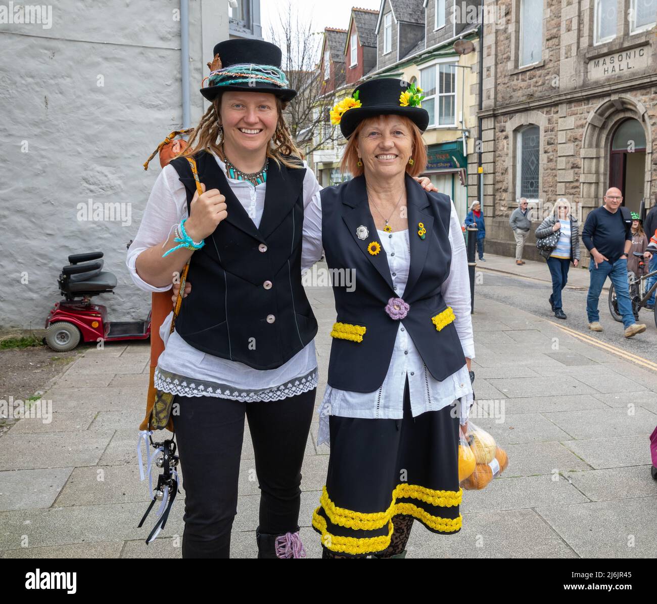 Two ladies dressed in costume on Trevithick Day in Camborne, Cornwall ...