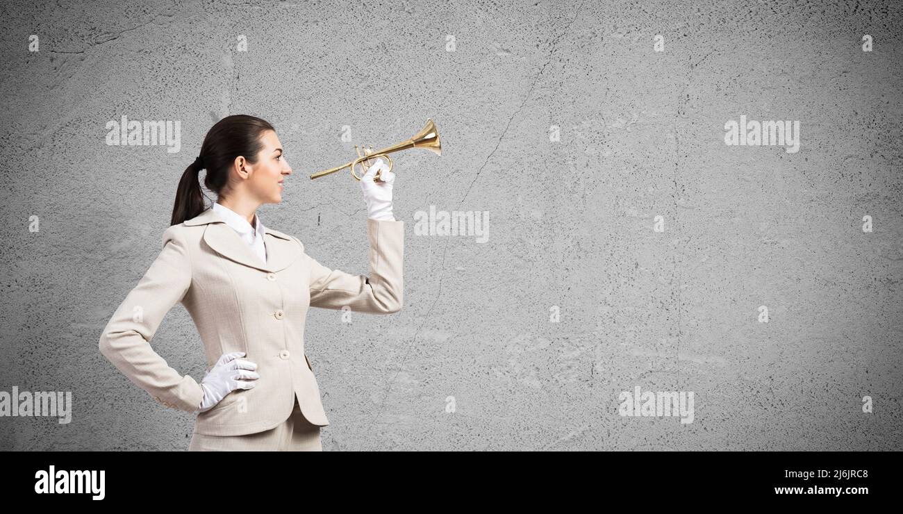 Woman playing trumpet brass instrument Stock Photo - Alamy