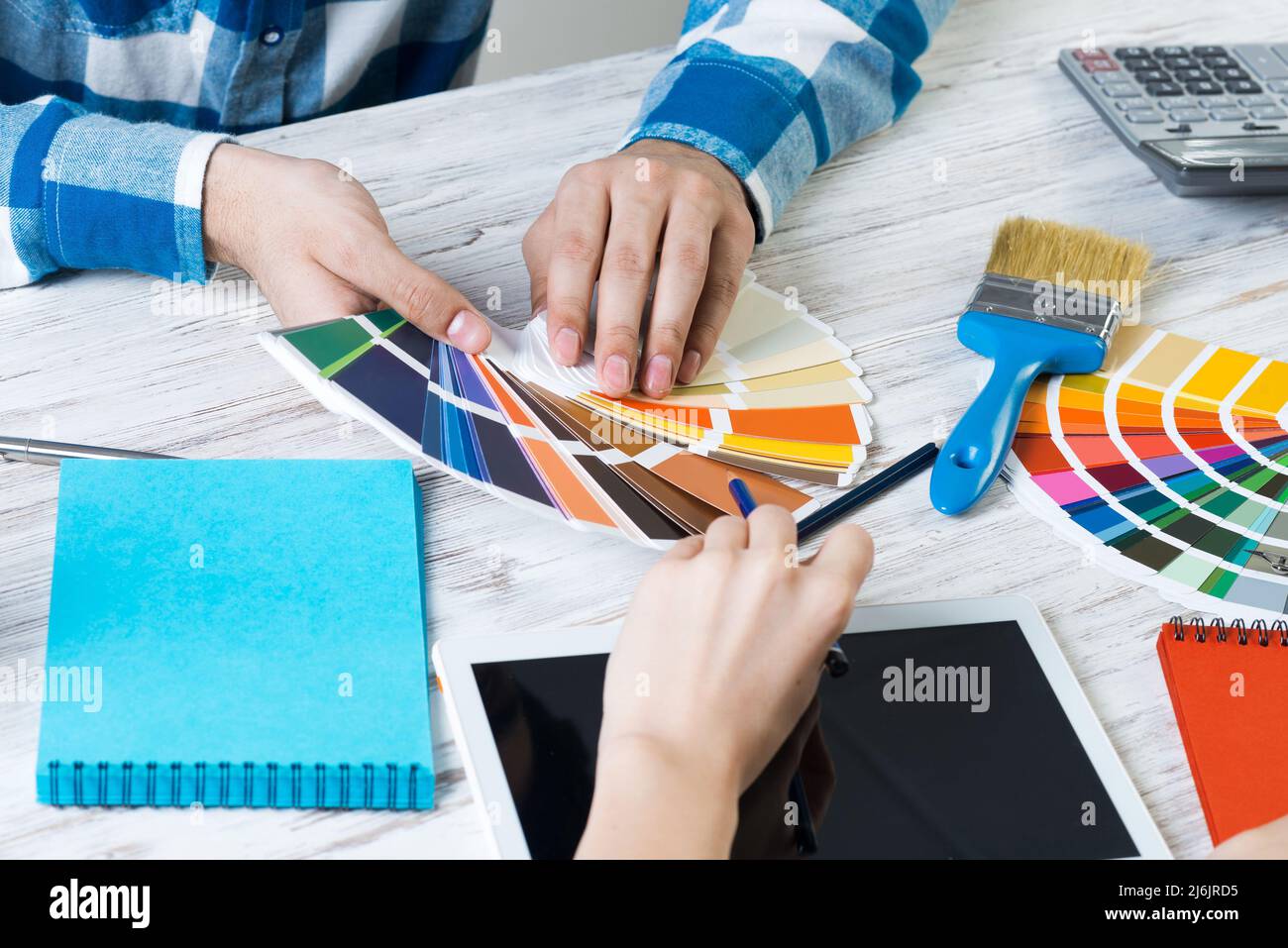 Interior designer choosing colors from swatches Stock Photo - Alamy