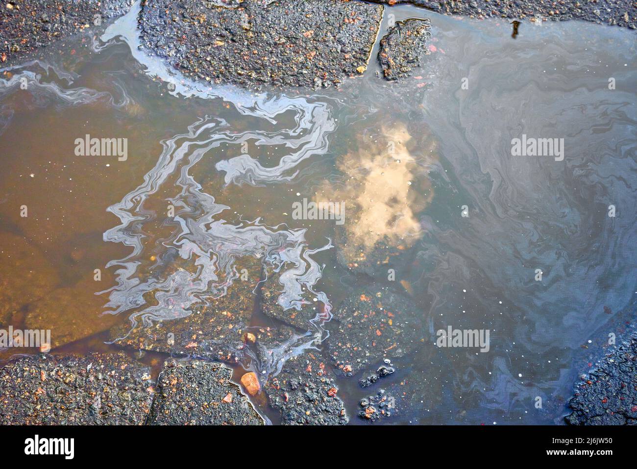 Oil rainbow in puddle hi-res stock photography and images - Alamy