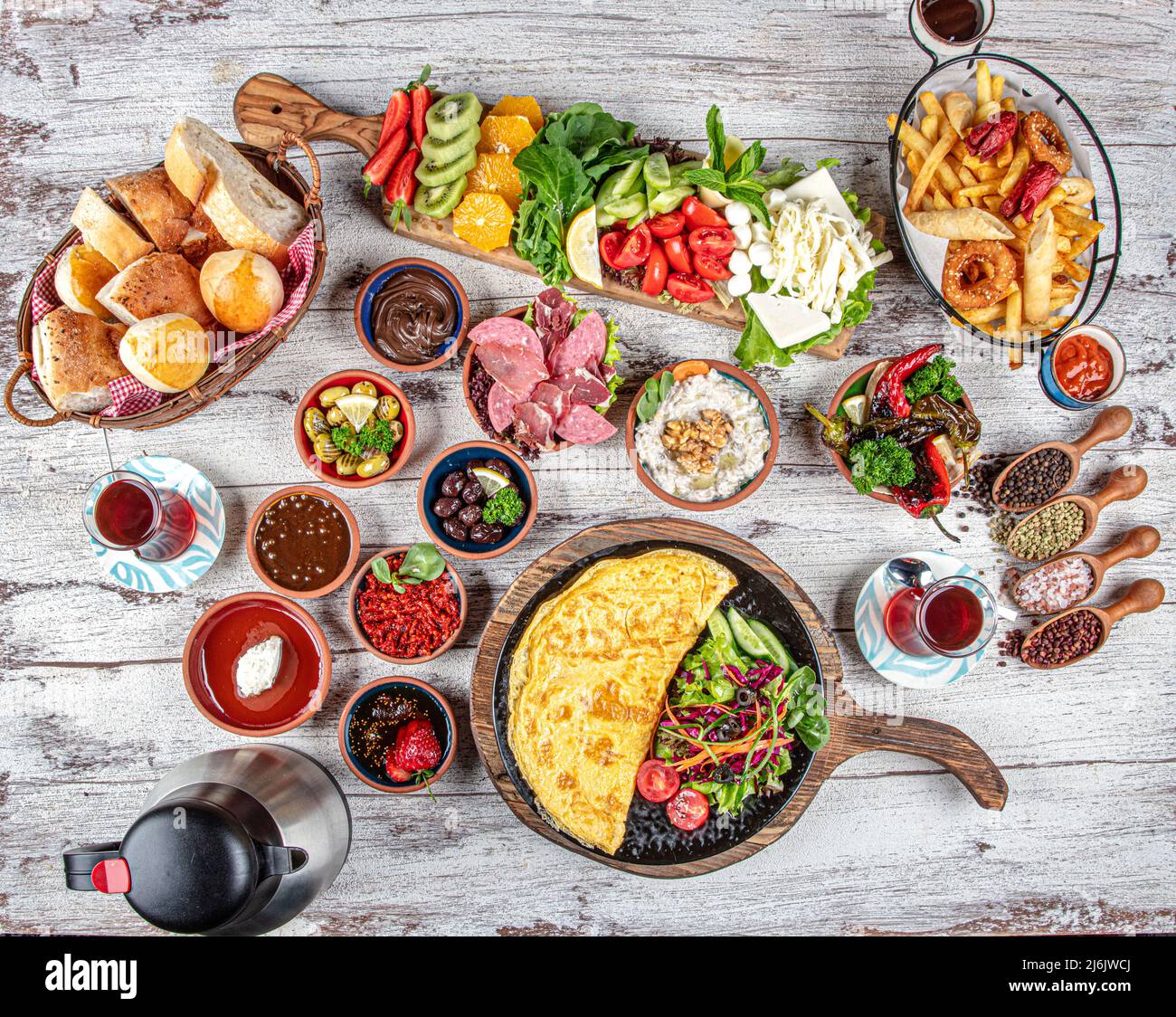 Turkish breakfast table. Pastries, vegetables, greens, olives, cheeses ...