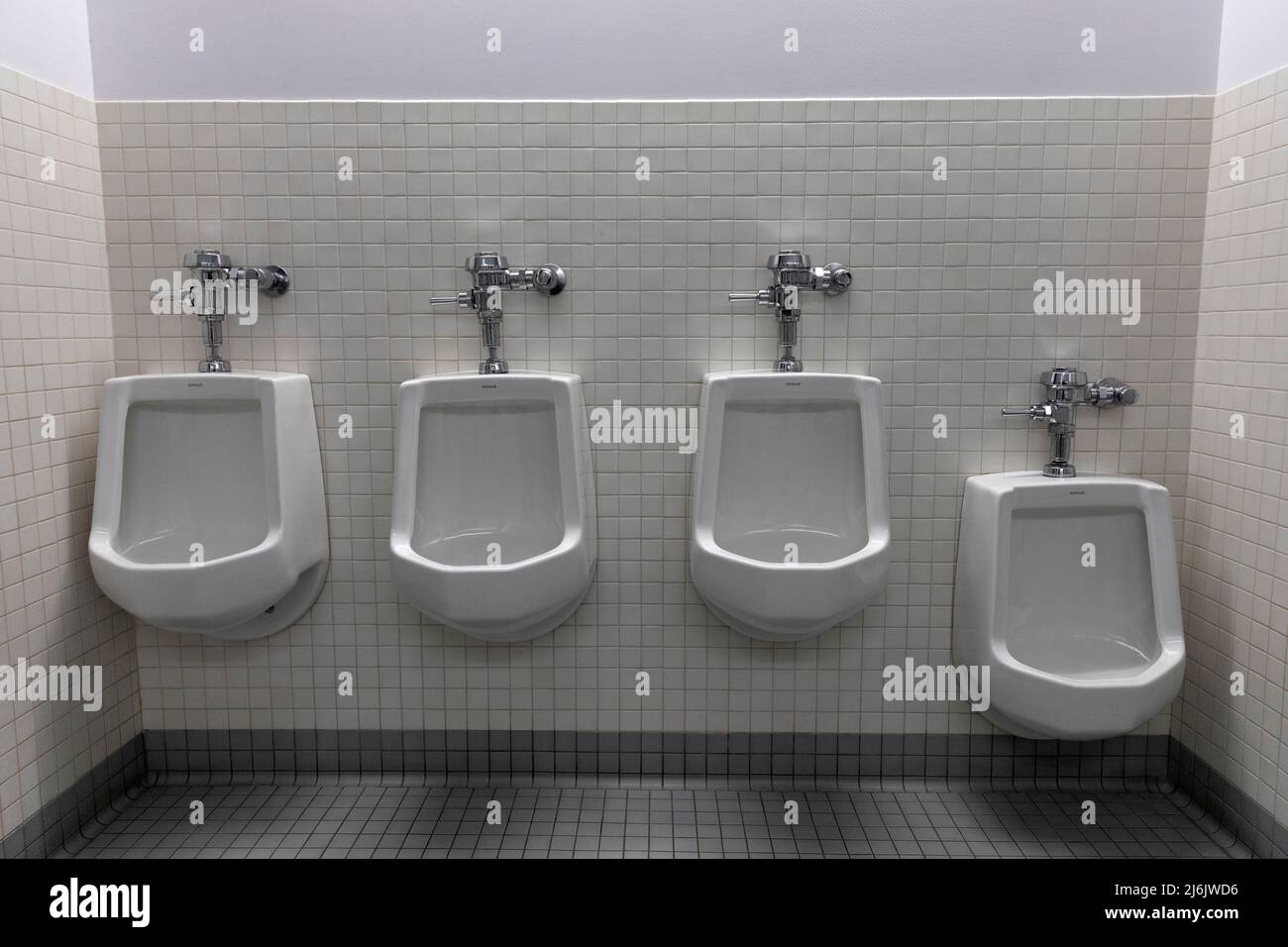 white porcelain urinals Stock Photo - Alamy
