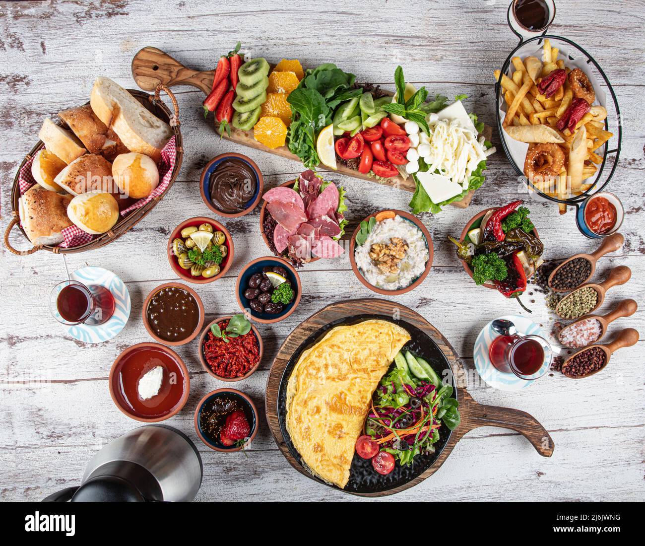 Turkish breakfast table. Pastries, vegetables, greens, olives, cheeses ...