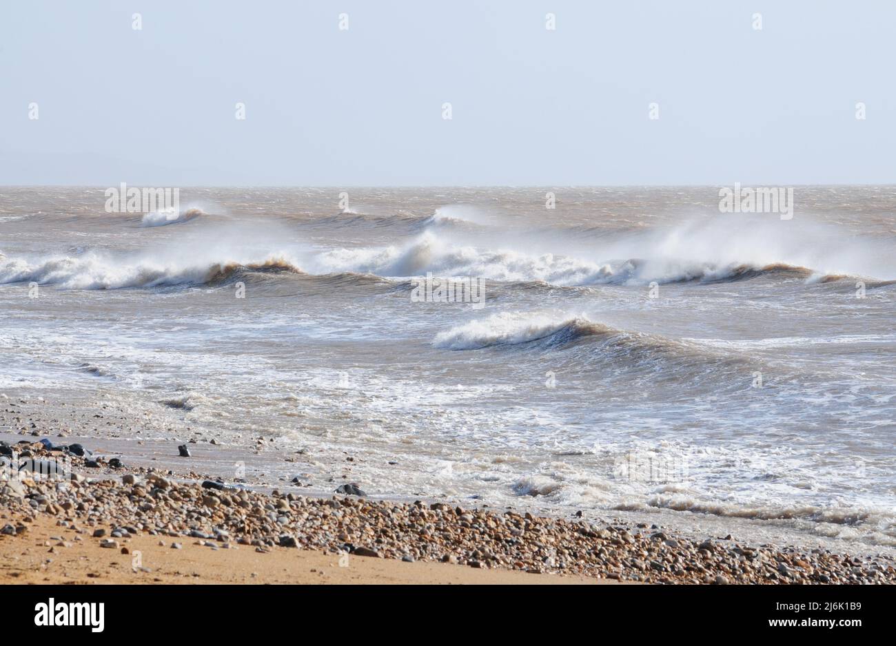 Wind driven waves on a stormy winter beach Stock Photo - Alamy