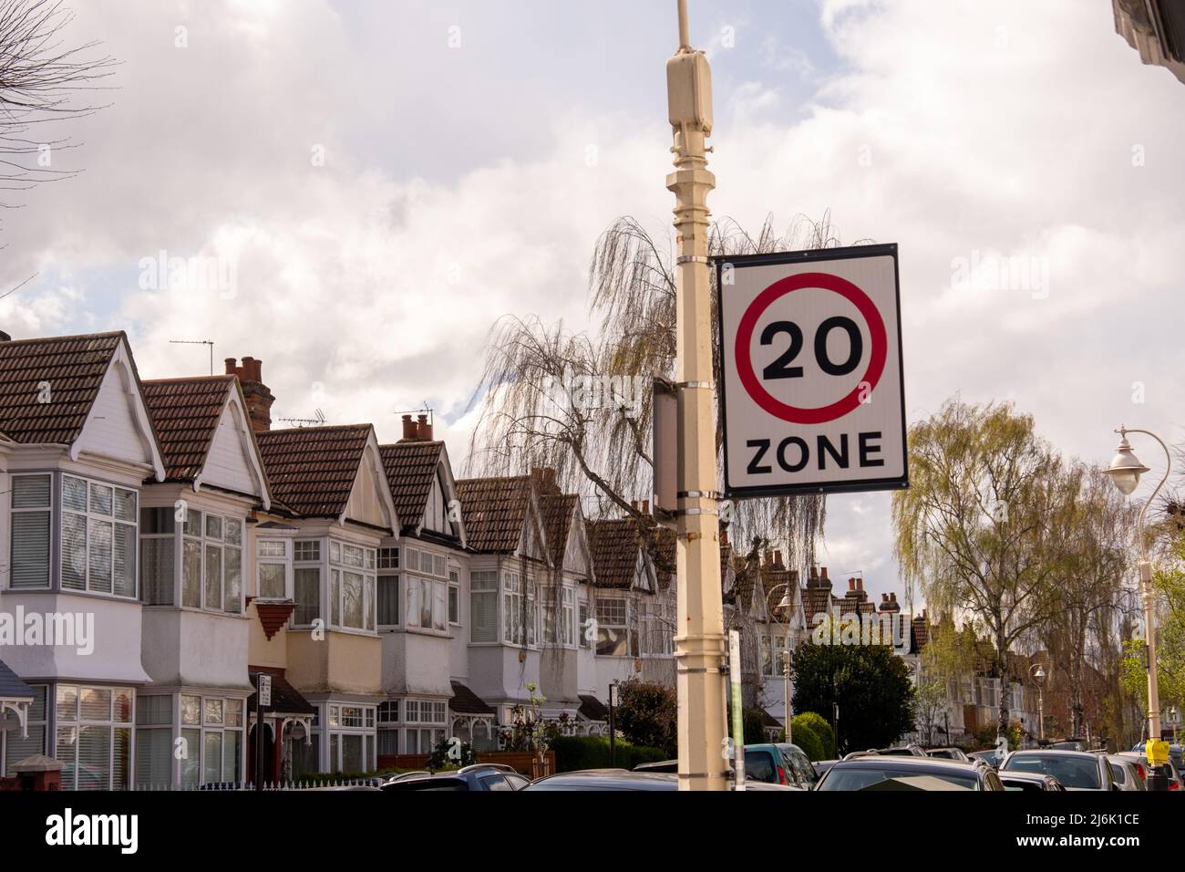 London- April 2022: 20 mph speed limit sign on residential street in ...