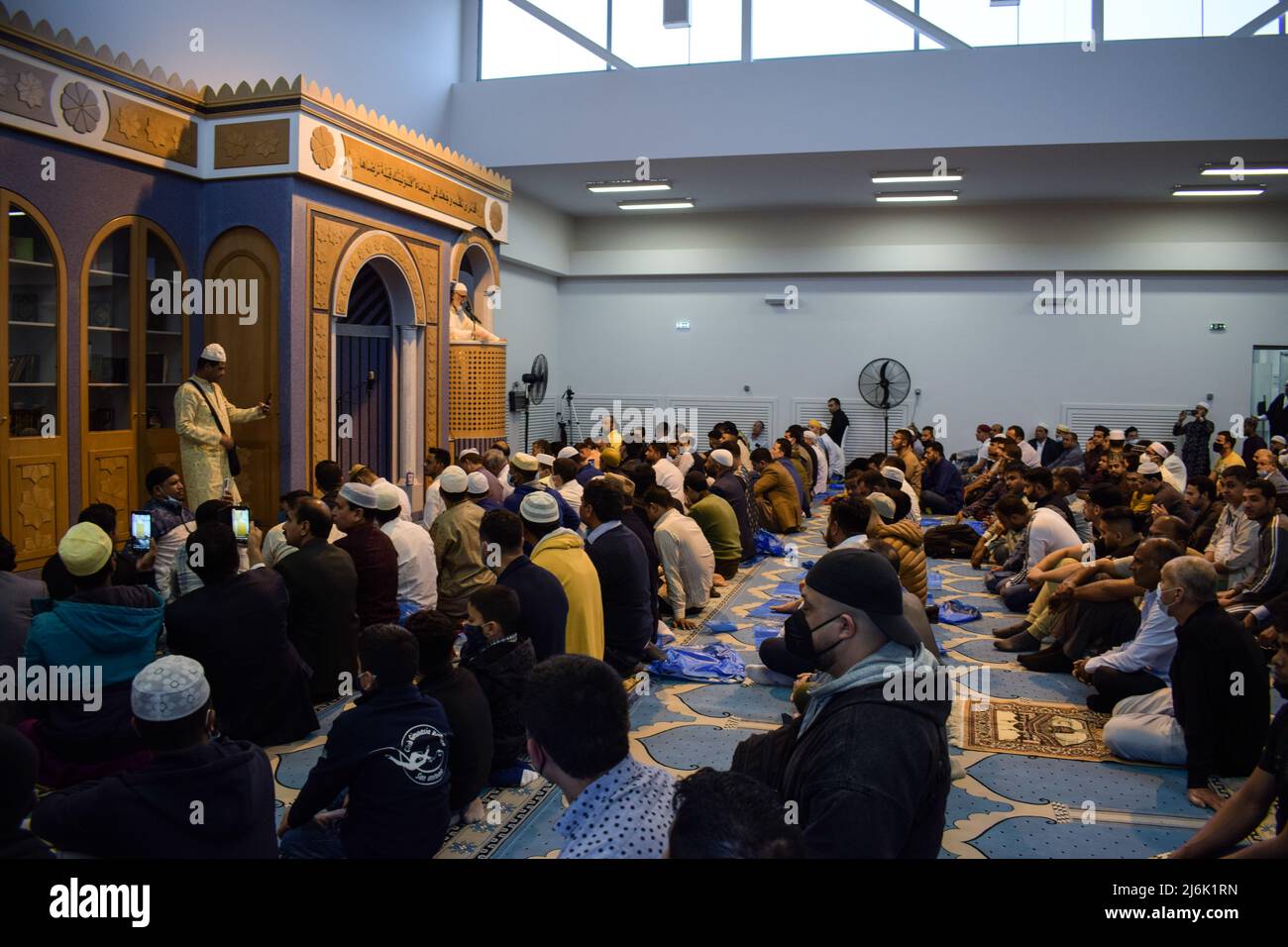 Worshipers gather to perform Eid al-Fitr prayer at the official mosque ...