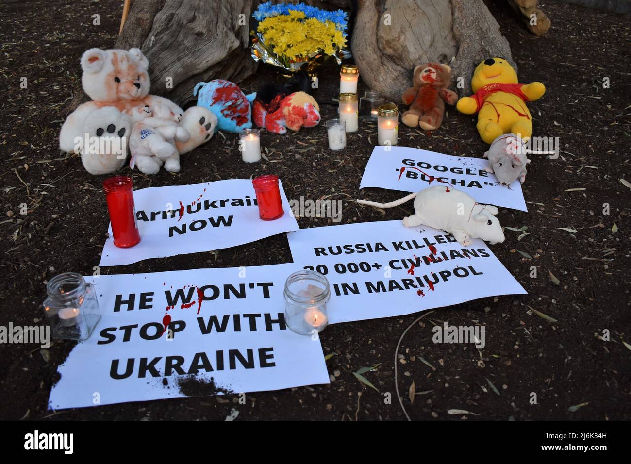 Stuffed animals and bloody posters in protest against massacre in ...