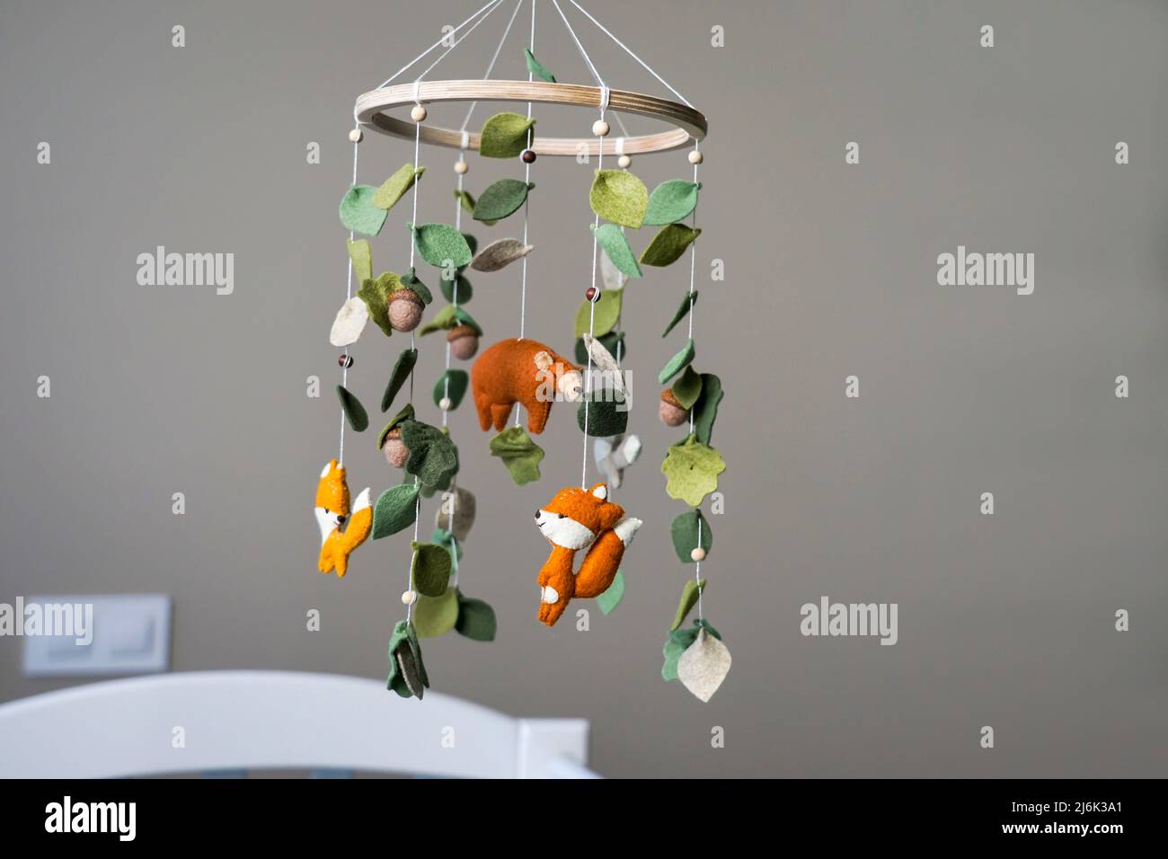 Diy craft baby crib mobile. Toys hang over the crib Stock Photo - Alamy
