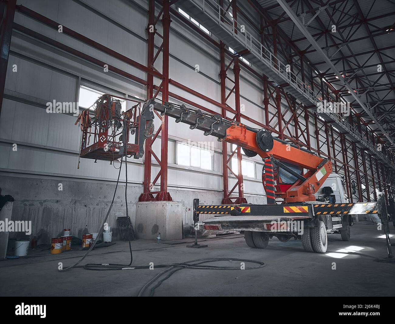 Telehandler inside of hangar Stock Photo - Alamy