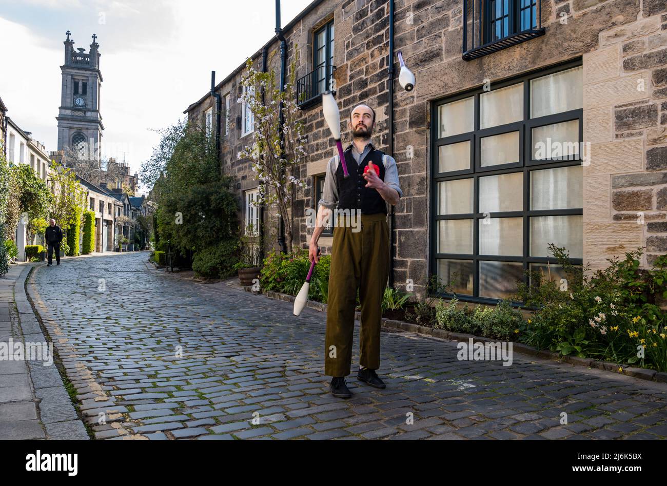 Circus act juggler, Robert Gallagher-Lyall practising juggling clubs ...