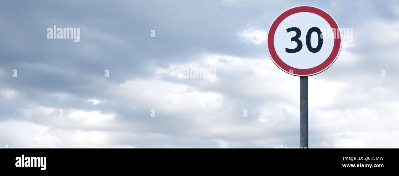 Road sign speed limit 30 km on sky background. Banner. Copy space Stock ...