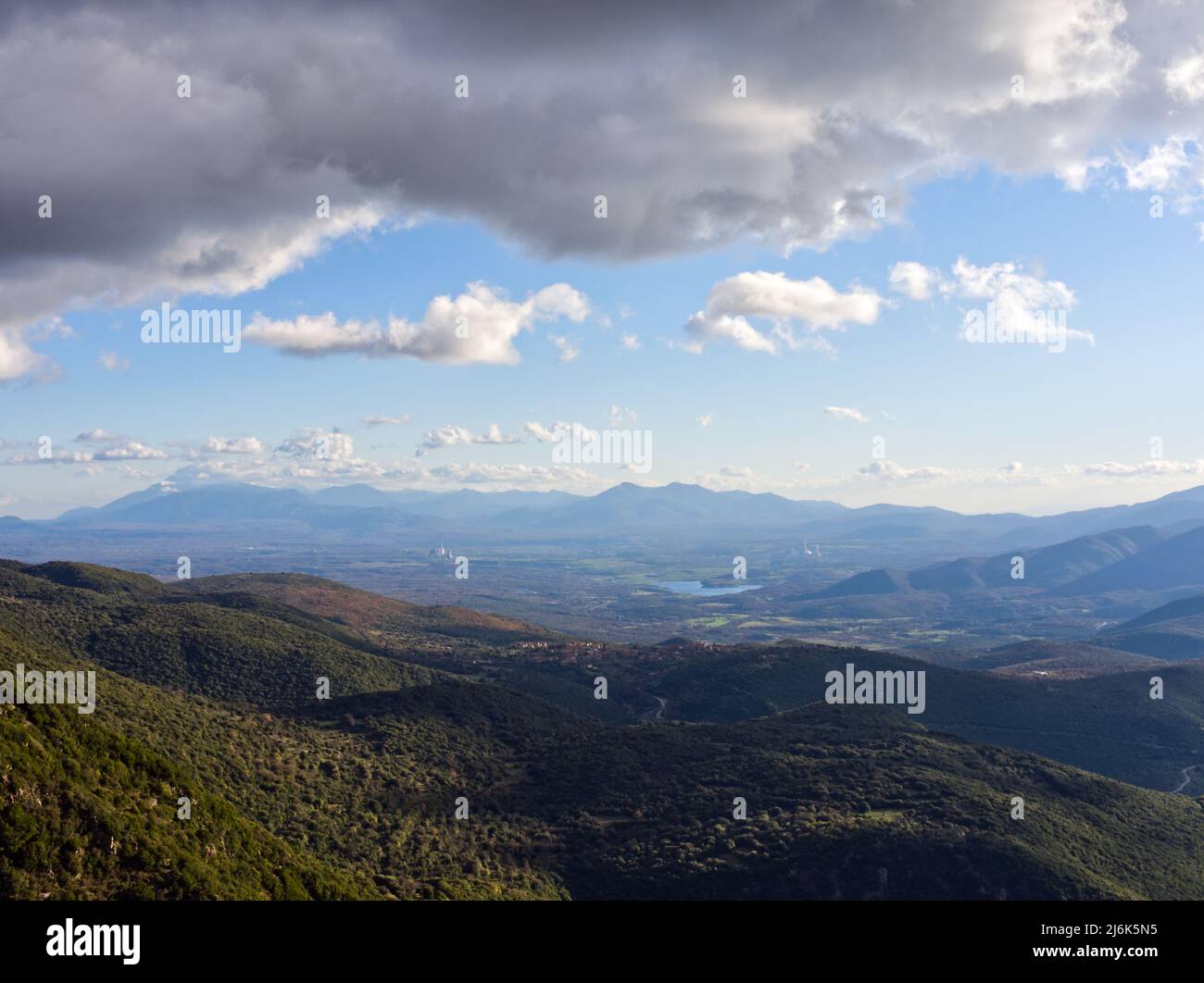 Cloudy afternoon landscape with sunset casting Stock Photo - Alamy