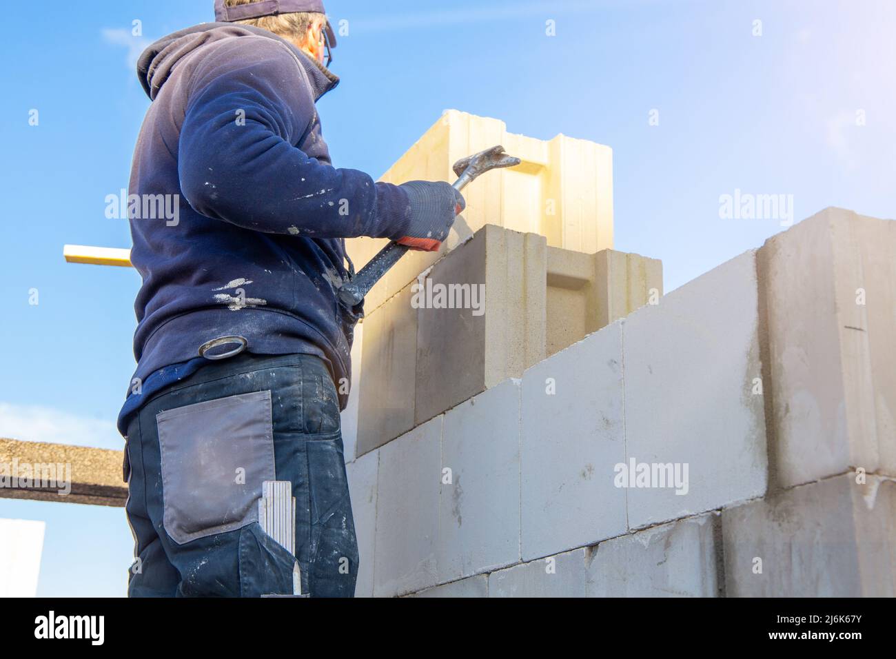 Construction worker (bricklayer) works on the construction site Stock ...