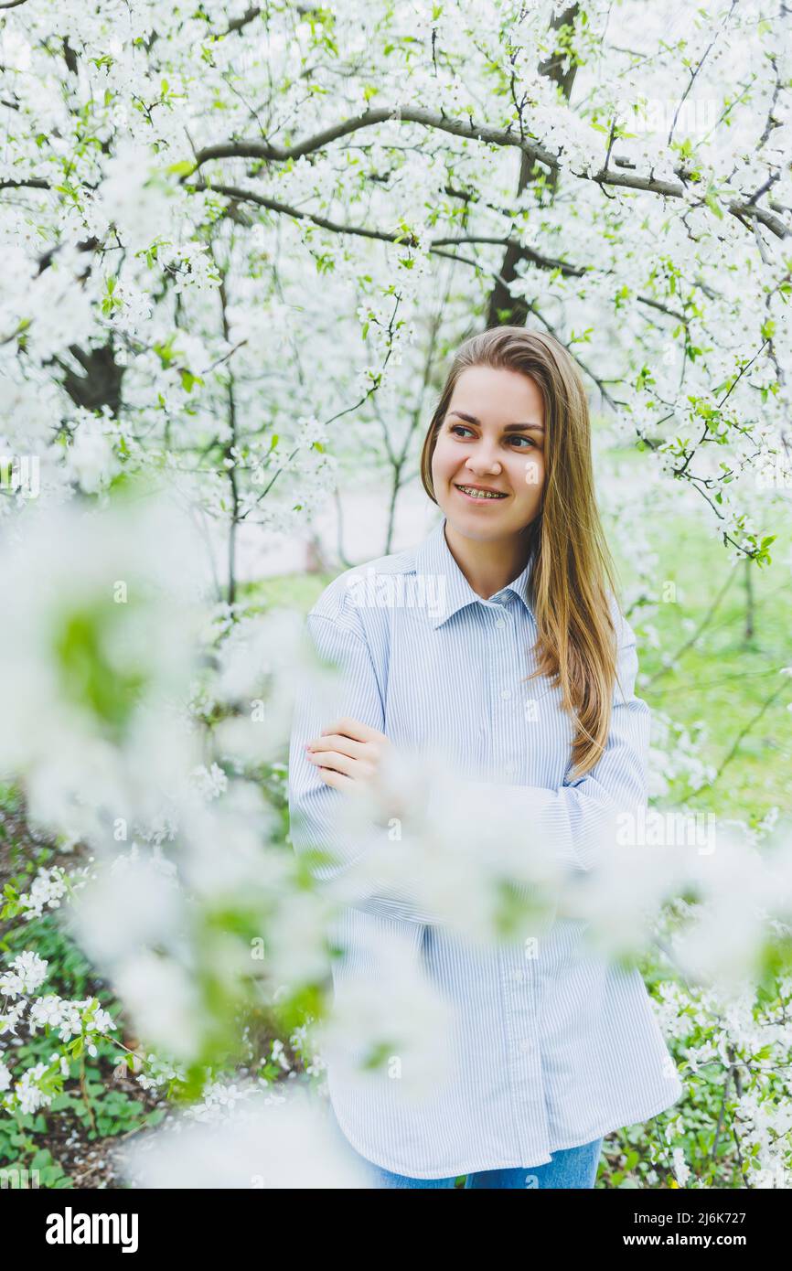 Portrait of beautiful romantic lady in apple trees blossoms Stock Photo ...
