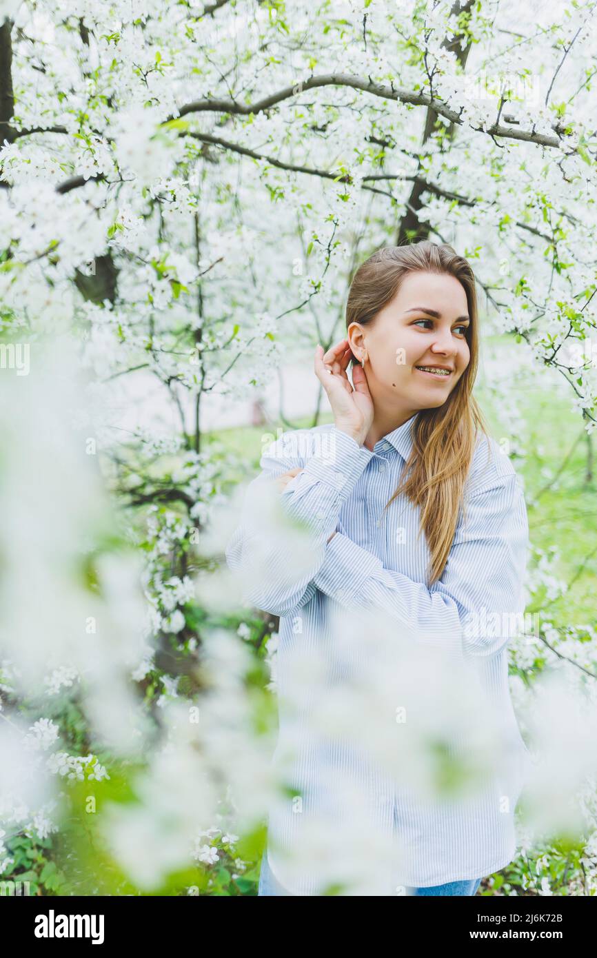 Portrait of beautiful romantic lady in apple trees blossoms Stock Photo ...