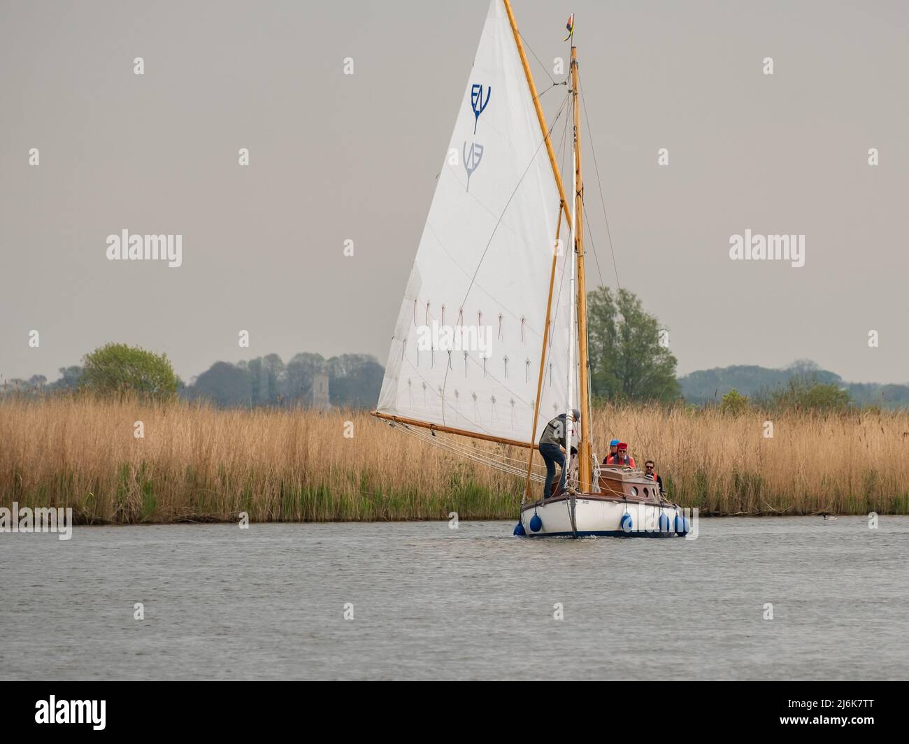 Traditional wooden sailboat sailing along the River Bure, Norfolk ...