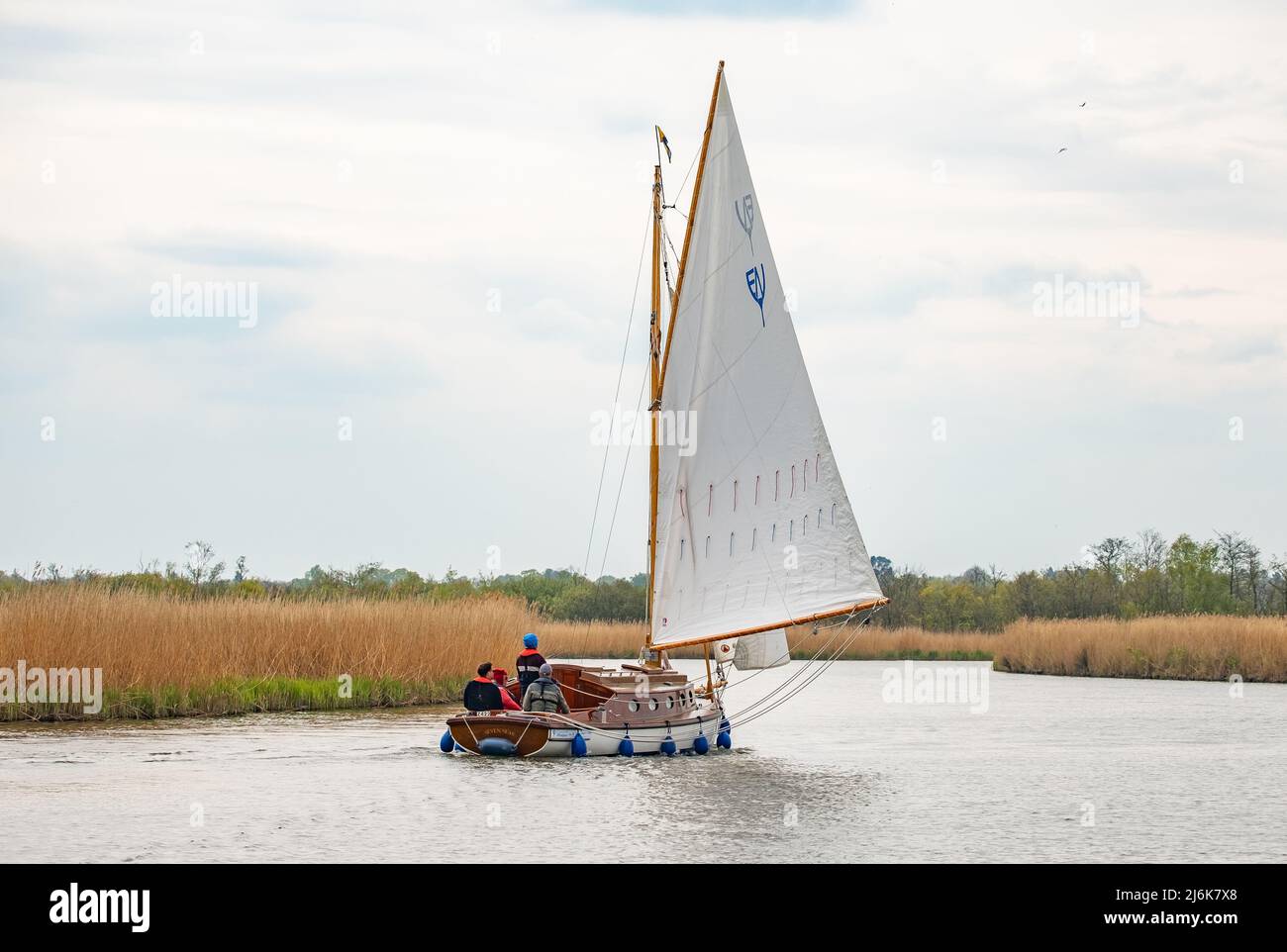 Traditional wooden sailboat sailing along the River Bure, Norfolk ...