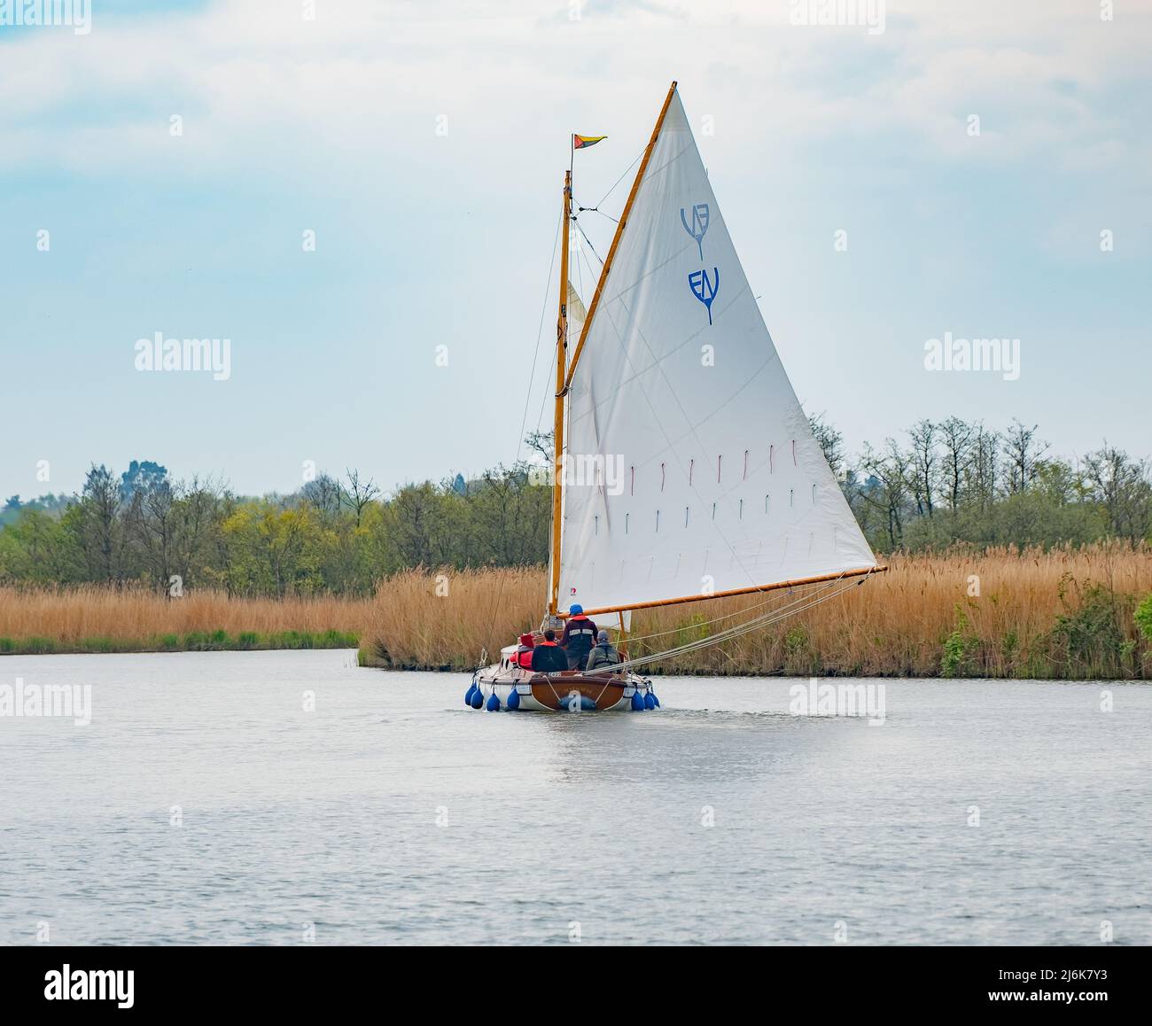 Traditional wooden sailboat sailing along the River Bure, Norfolk ...