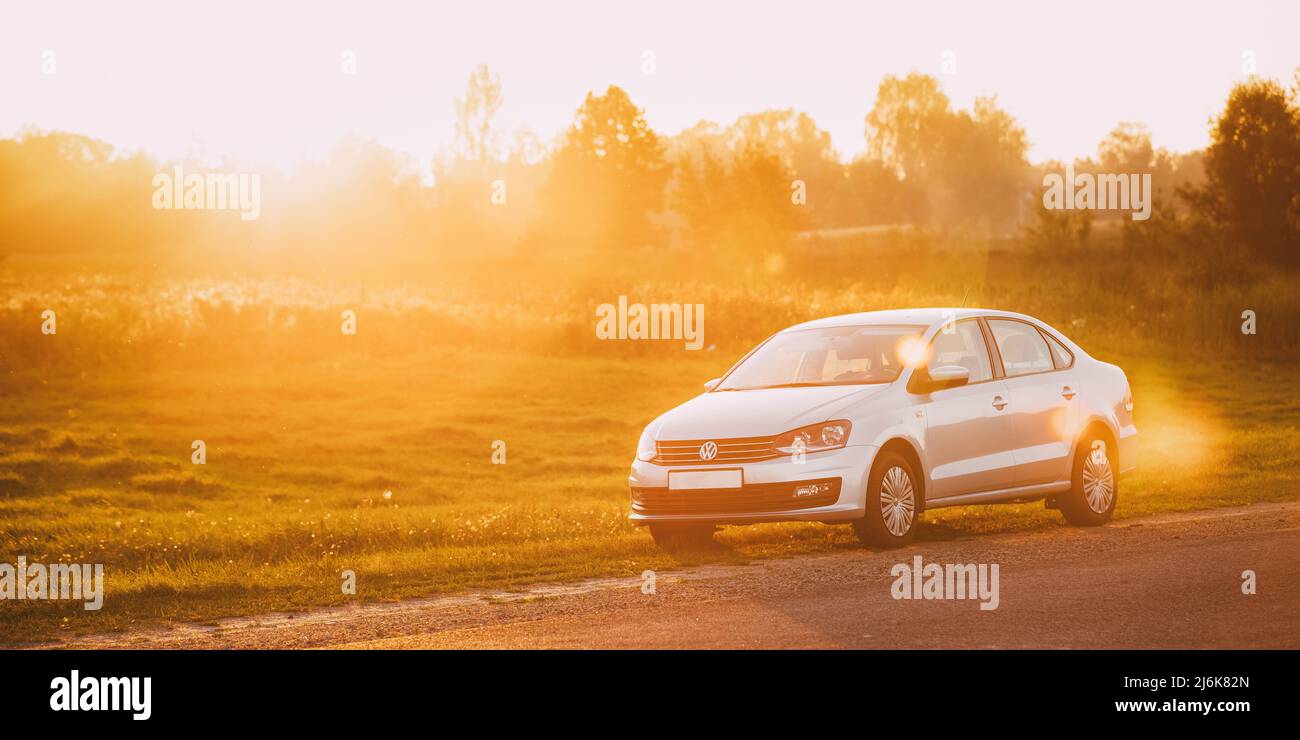Volkswagen Polo Car Parking On A Roadside Of Country Road During Sunset ...