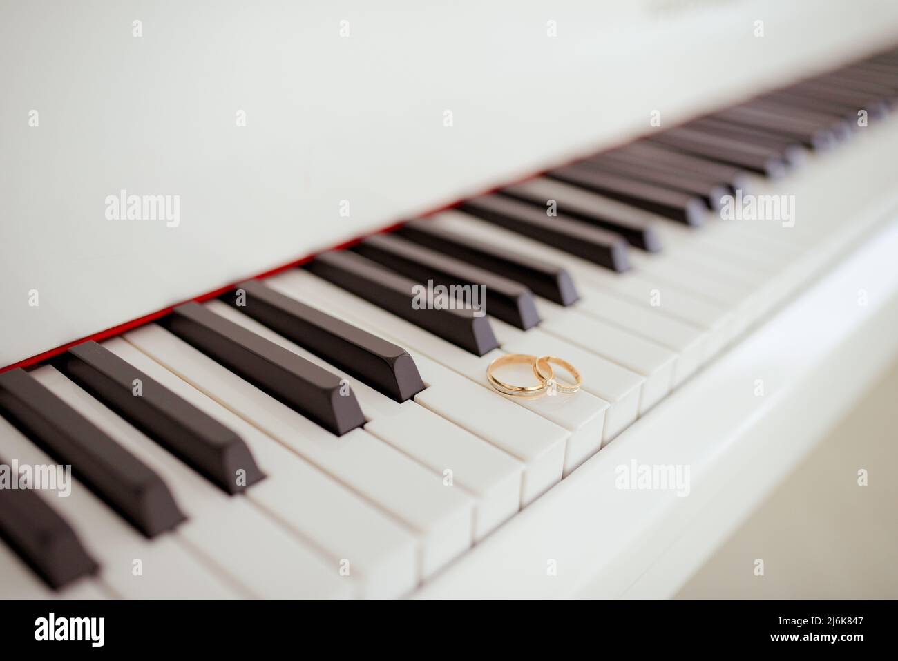 Wedding rings on the piano Stock Photo - Alamy