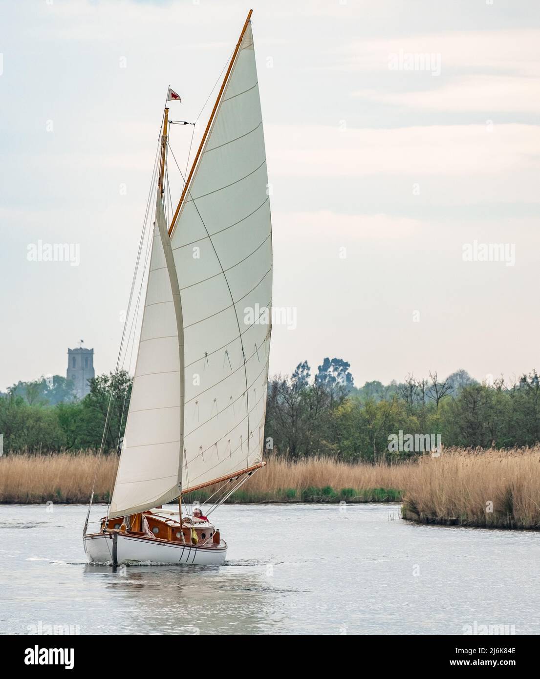 Traditional wooden sailboat sailing along the River Bure, Norfolk ...