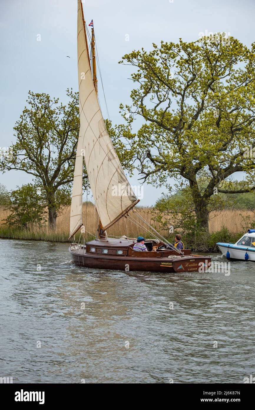 Traditional wooden sailboat sailing along the River Bure, Norfolk ...