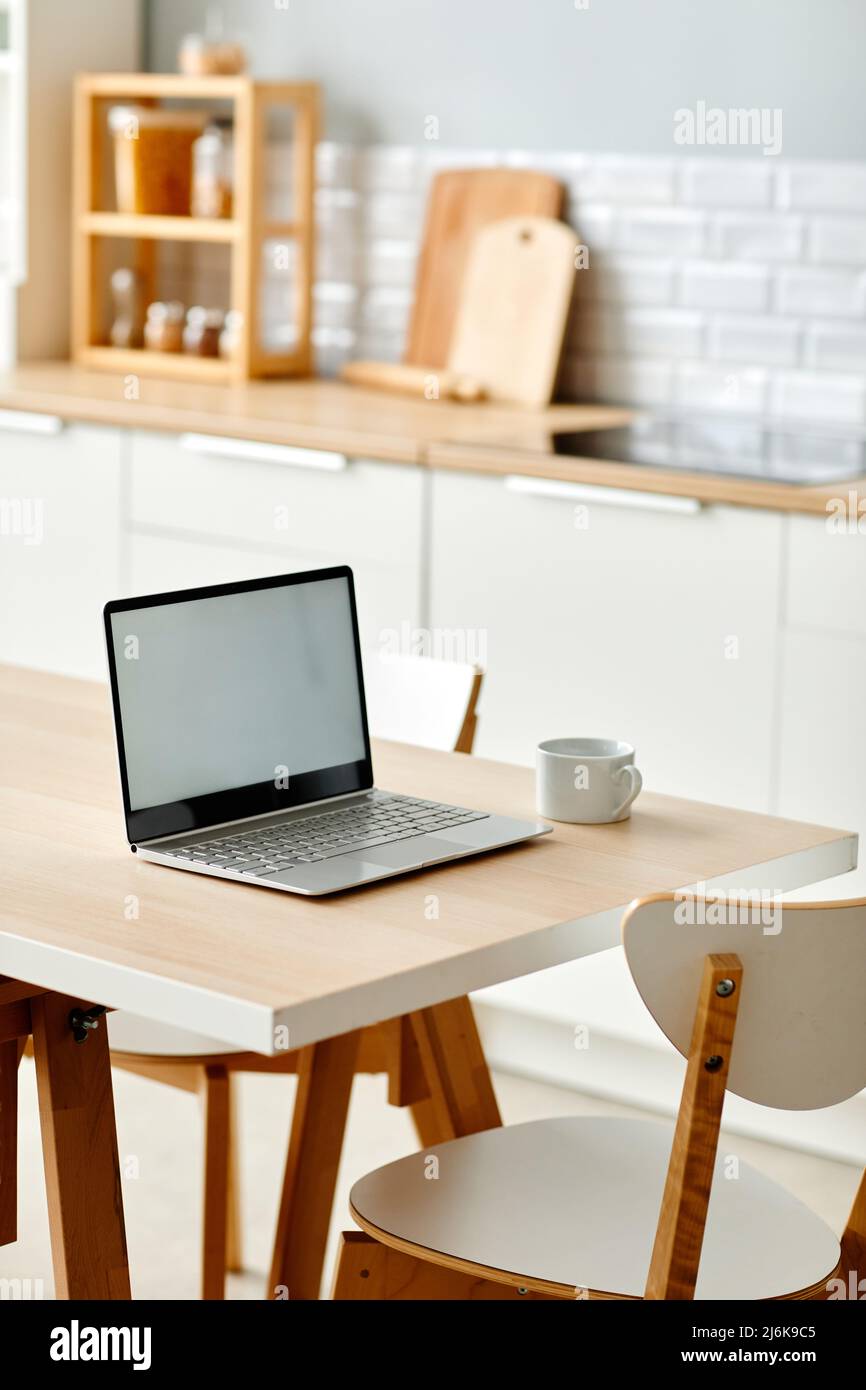 Vertical background image of minimal home workplace with laptop on ...