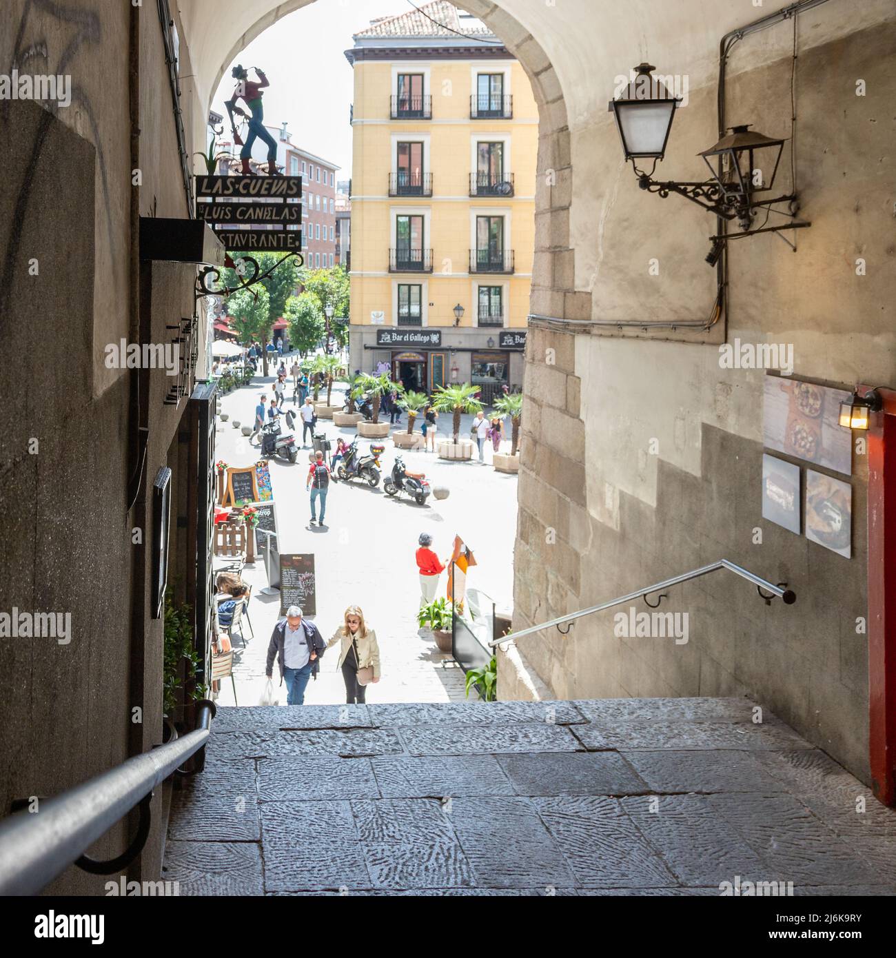 A busy plaza mayor with one the many arches as tourism is back in full ...