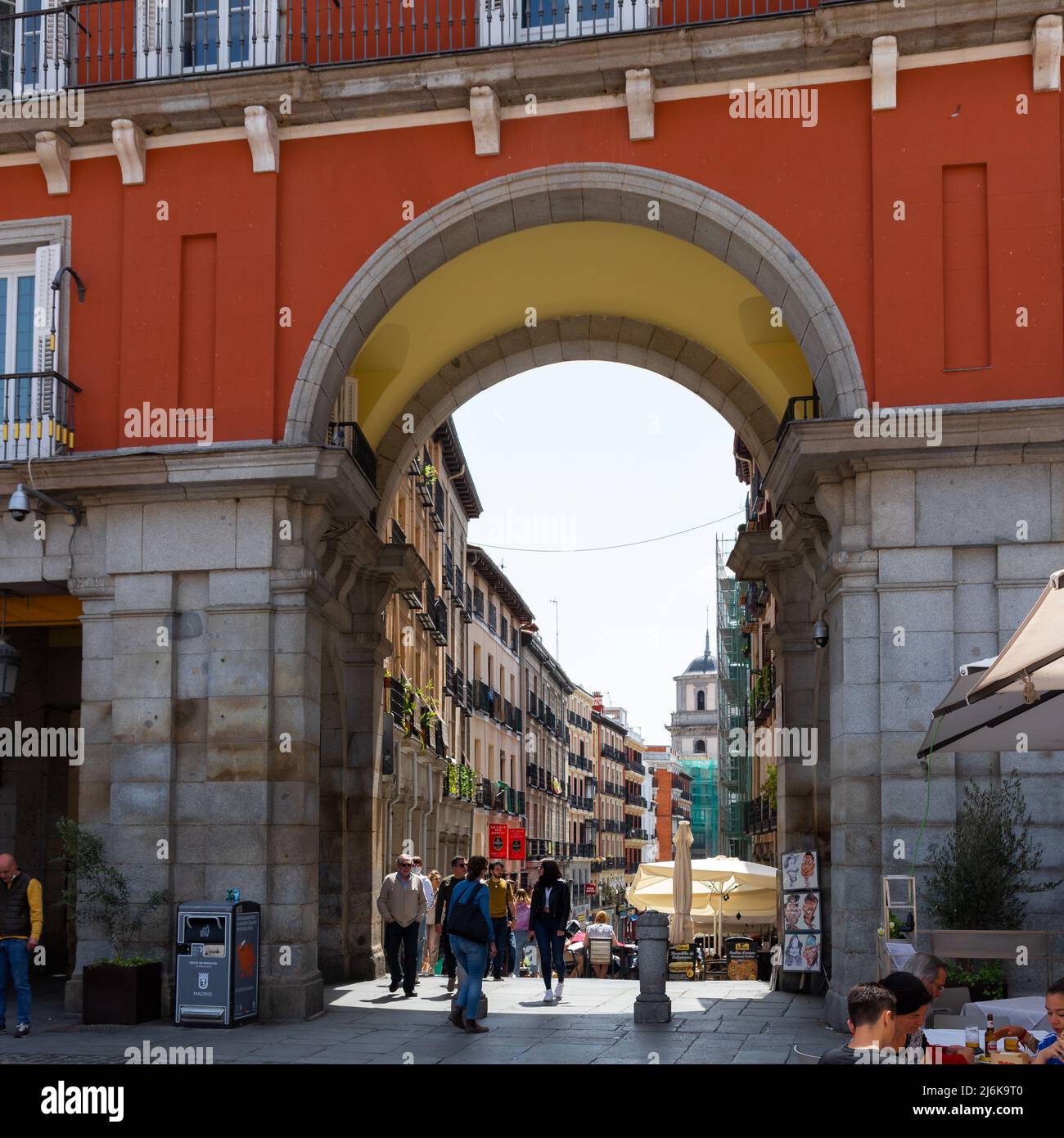 A busy plaza mayor with one the many arches as tourism is back in full ...