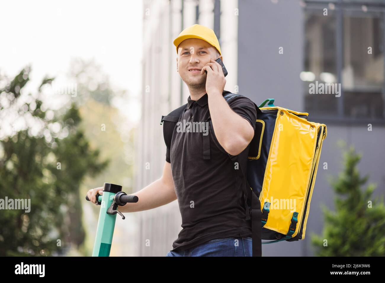 Food delivery guy with yellow backpack deliver orders. Male courier ...