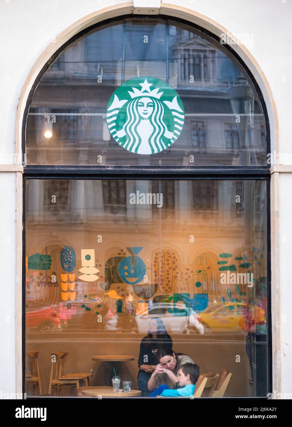 Bucharest, Romania - 04.08.2022: Photo through the windows of Starbucks ...