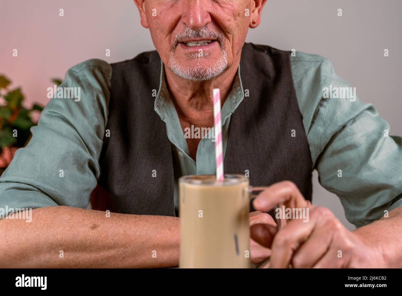 Man drink coffee through a straw hi-res stock photography and images ...