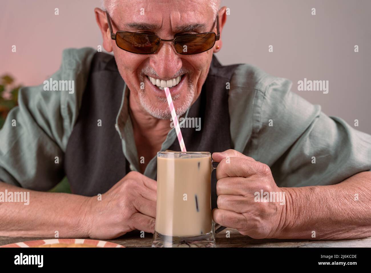 Man drink coffee through a straw hi-res stock photography and images ...