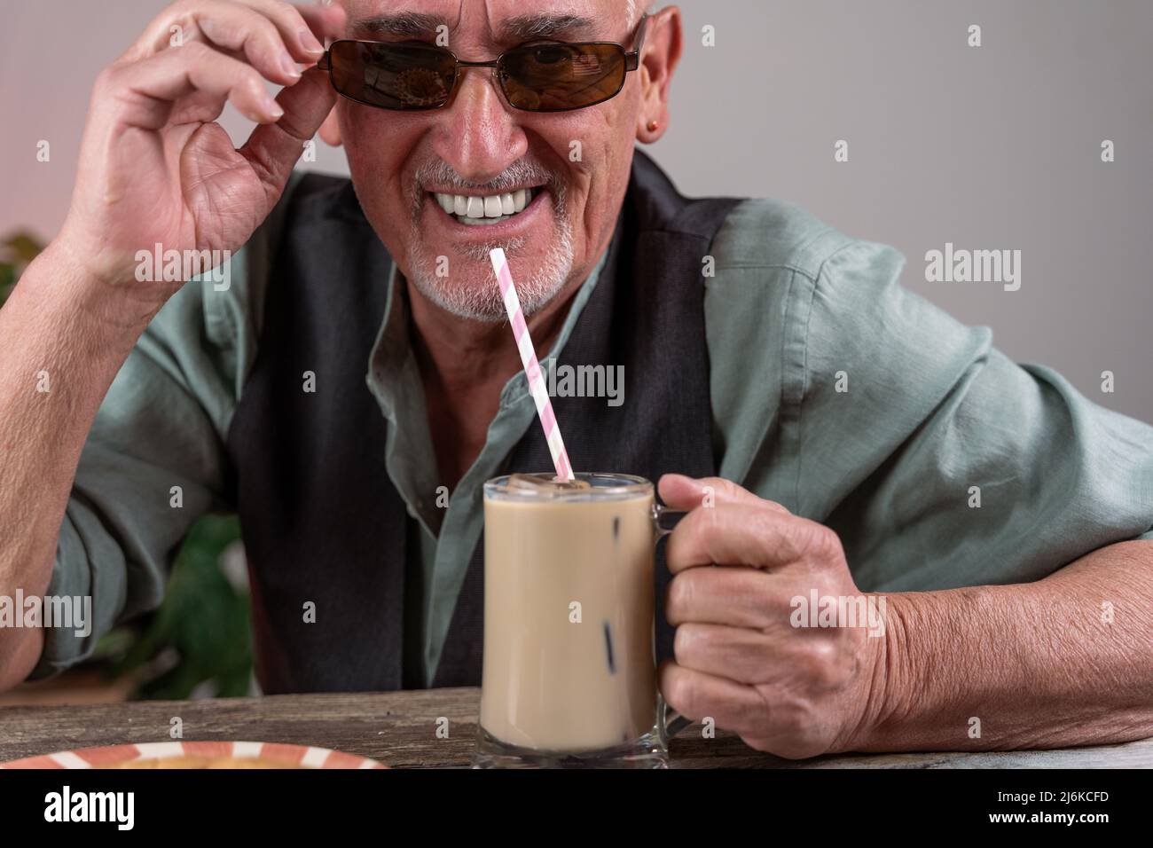 Man drink coffee through a straw hi-res stock photography and images ...