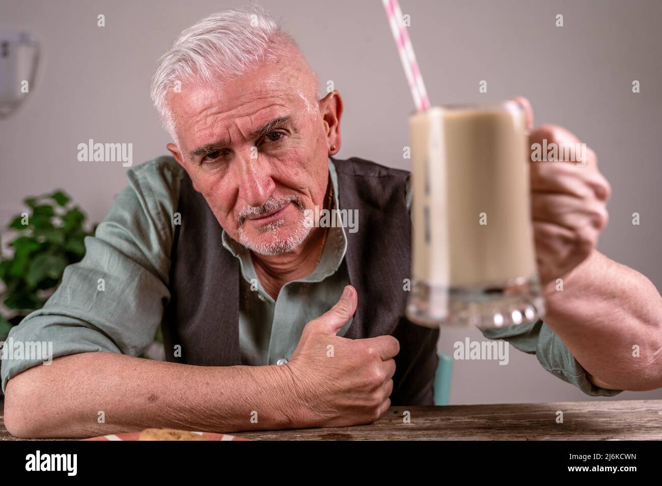 Man drink coffee through a straw hi-res stock photography and images ...