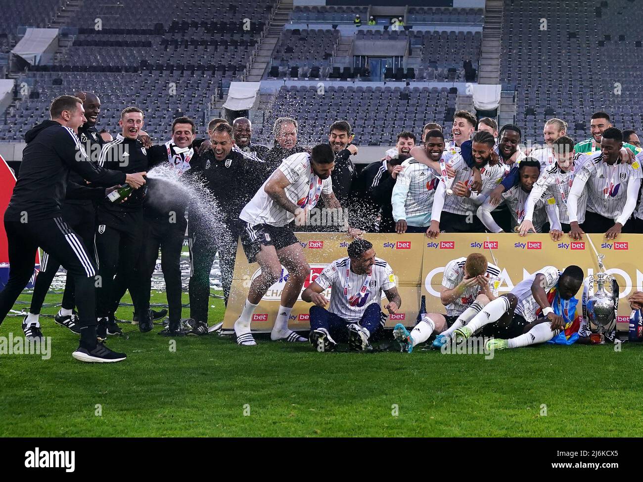 Fulham players celebrate with the Championship trophy after being ...