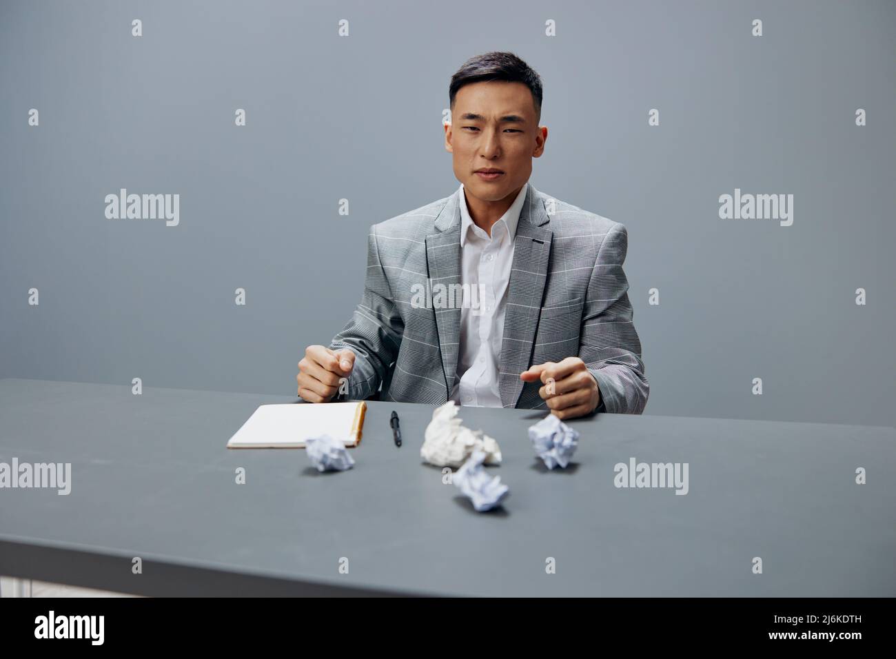 manager in a gray suit crumpled paper office official emotions ...