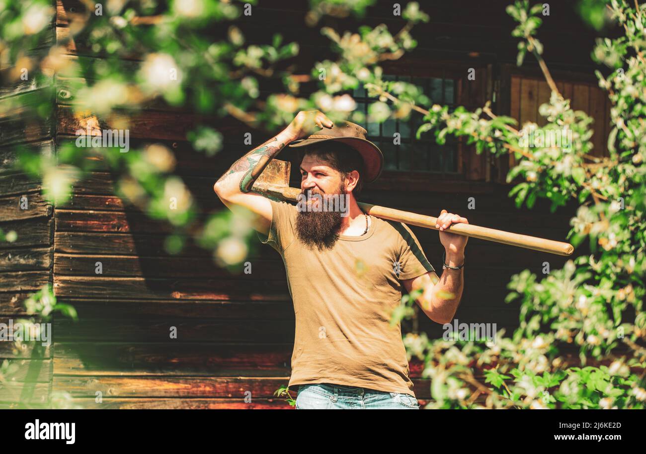Farmer working on field. Crop planting at fields. Portrait of father ...