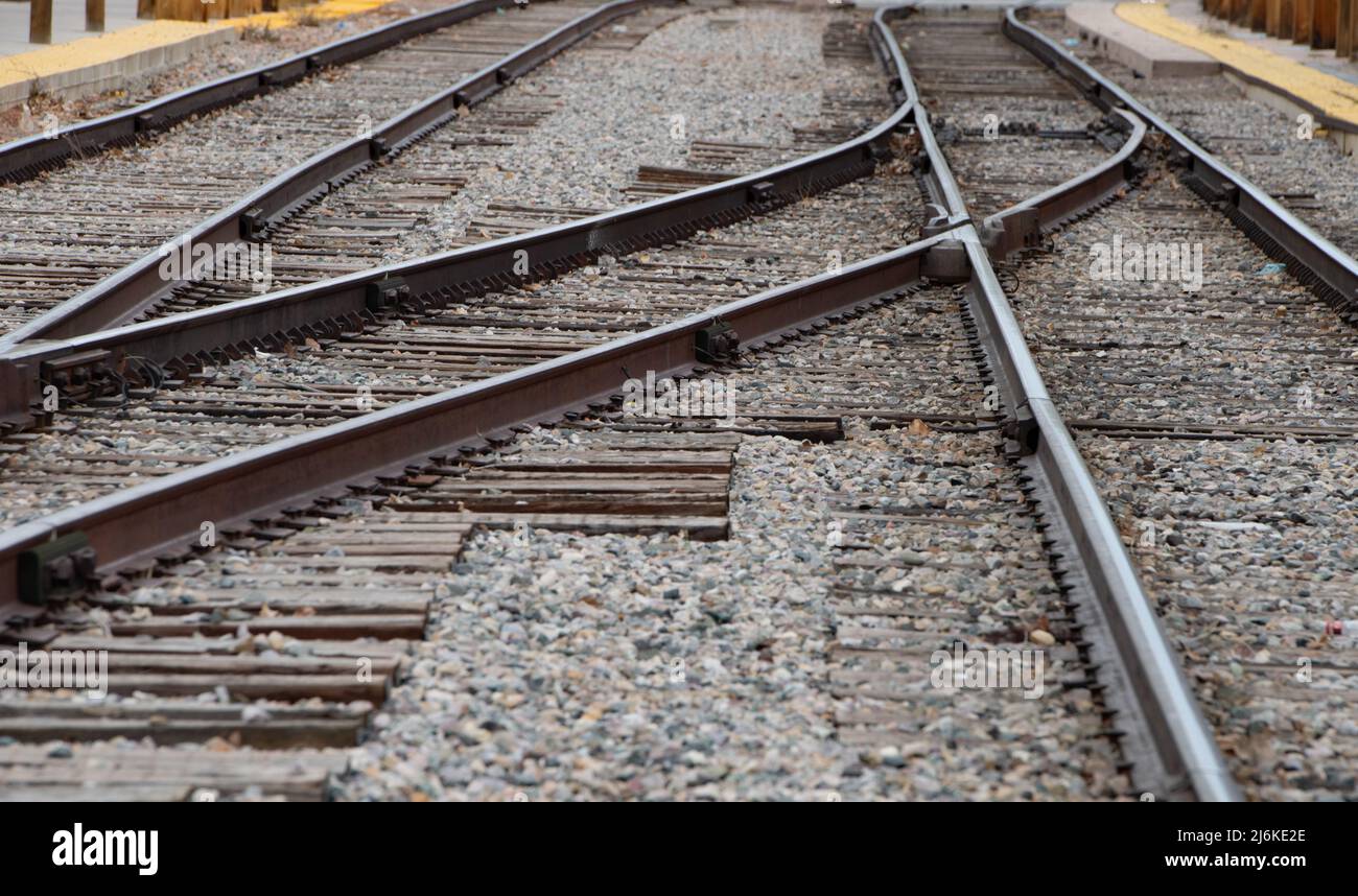 metal railroad tracks straight and curved lines converging into each ...