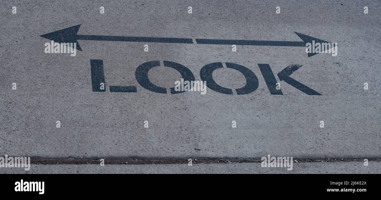 Pedestrian crossing look left sign hi-res stock photography and images ...