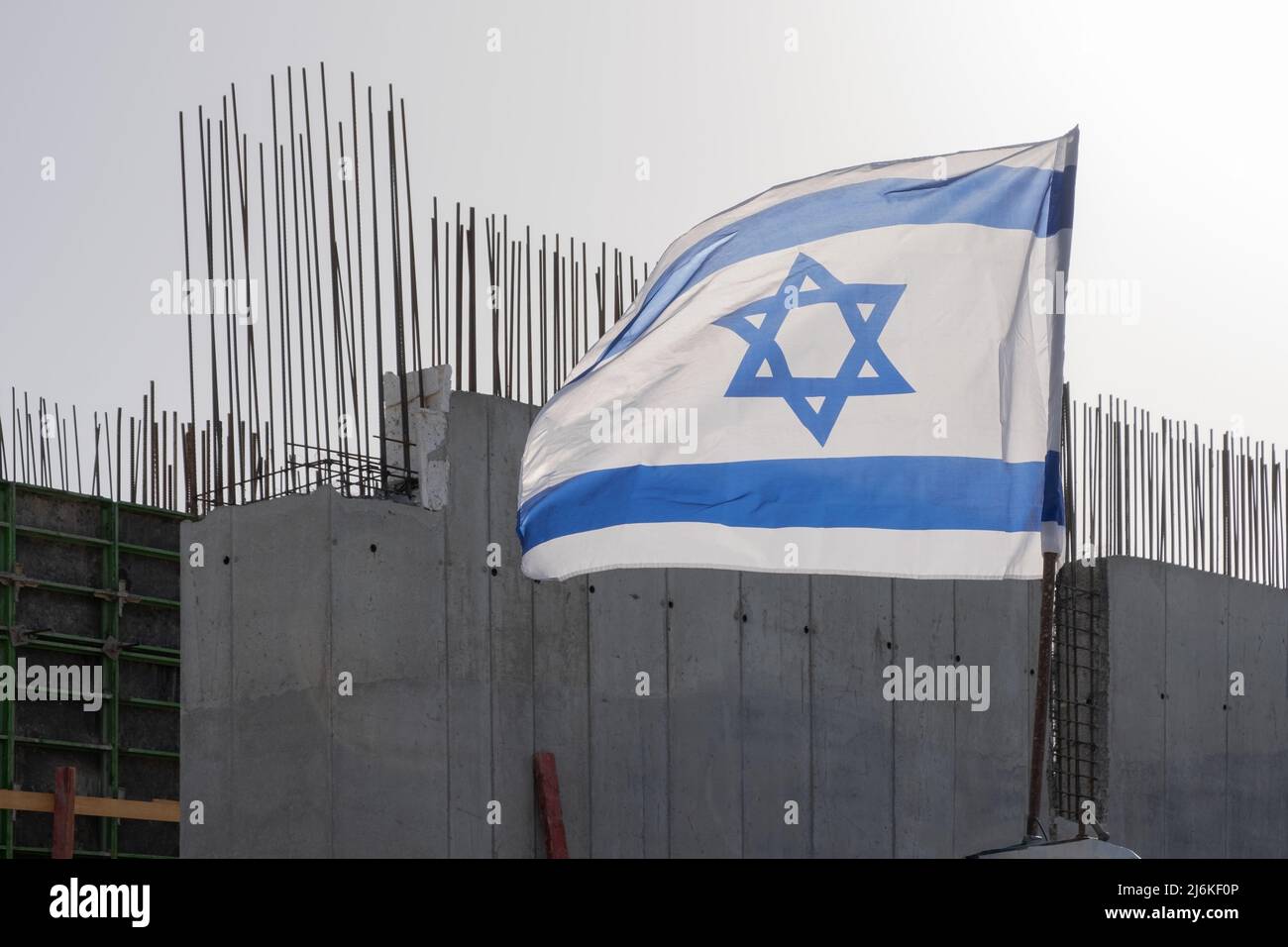 National Israeli flag on Construction site in bg. The beginning of the ...