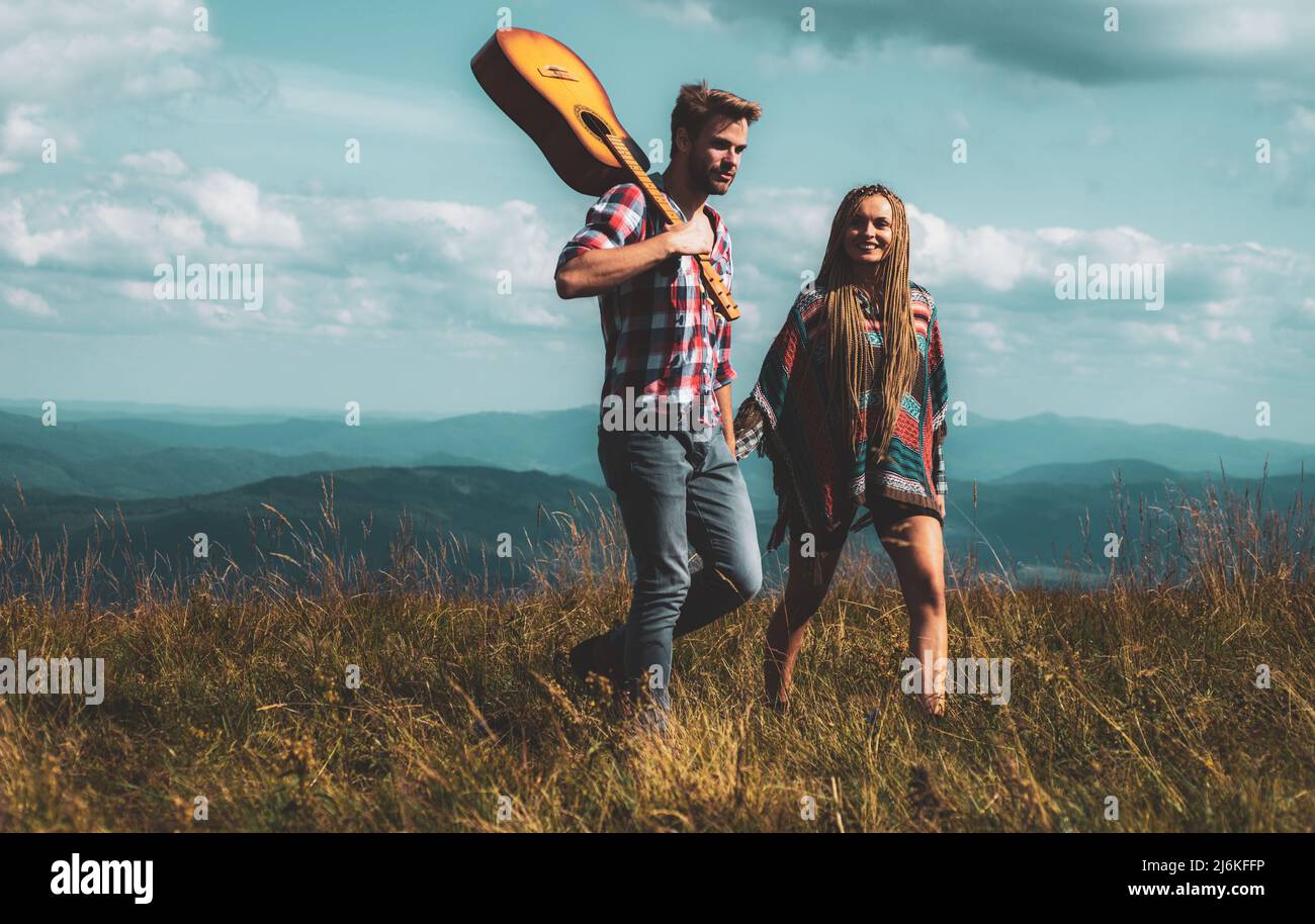 Young couple of tourists are exploring new places together. Attractive ...