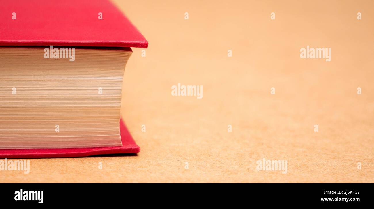 Closed thick red book pages side view simple abstract wide banner ...