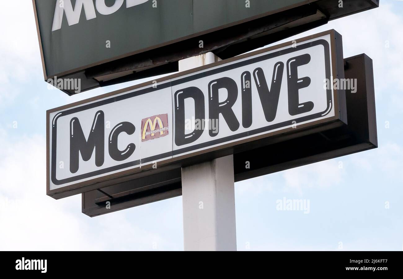 McDonalds company McDrive drive thru outdoors signpost logo sign pole ...
