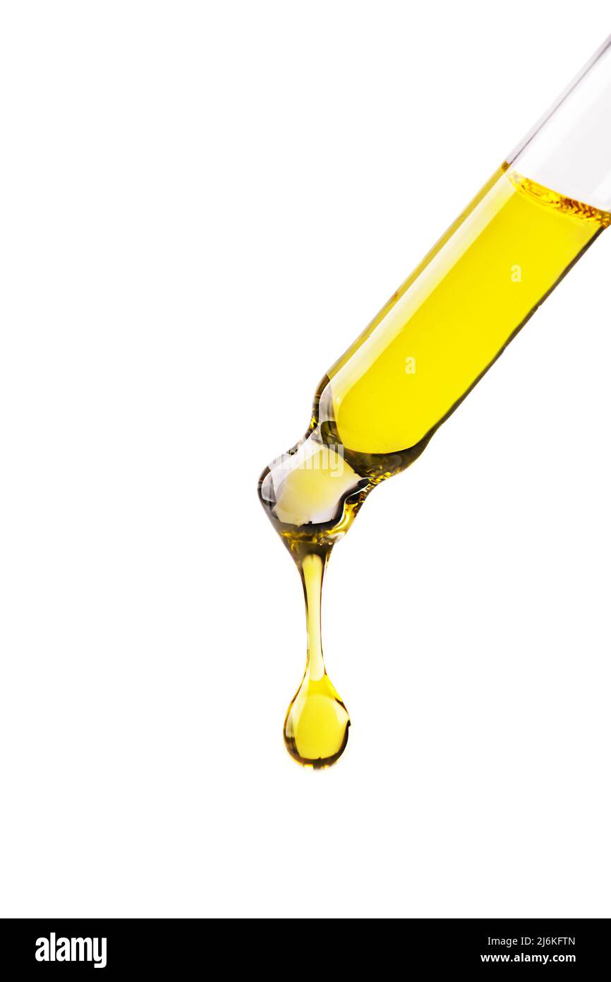 Dropper with cosmetic oil drop isolated on white background. Abstract ...