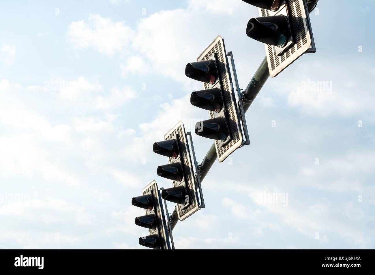 Multiple traffic lights in a row, turned off, not working, outdoors ...