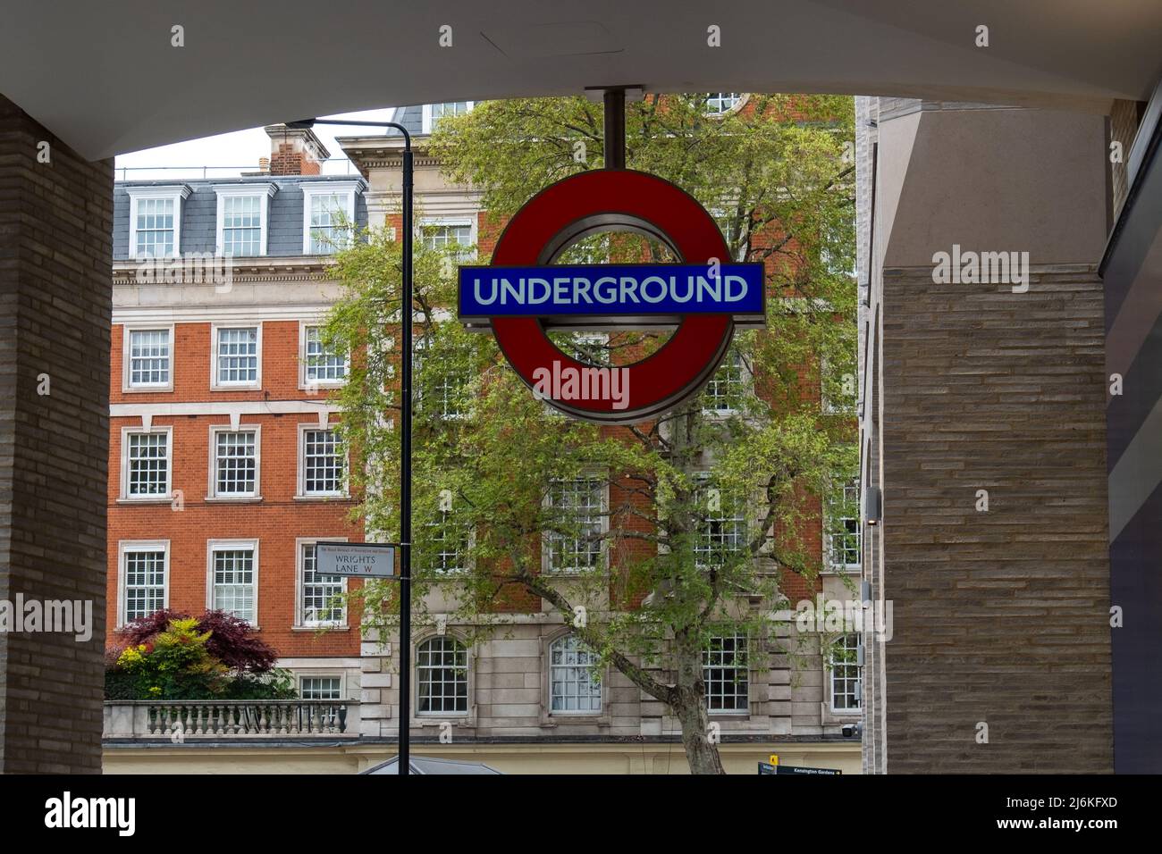 London, April 2022: London underground symbol at High Street Kensington ...