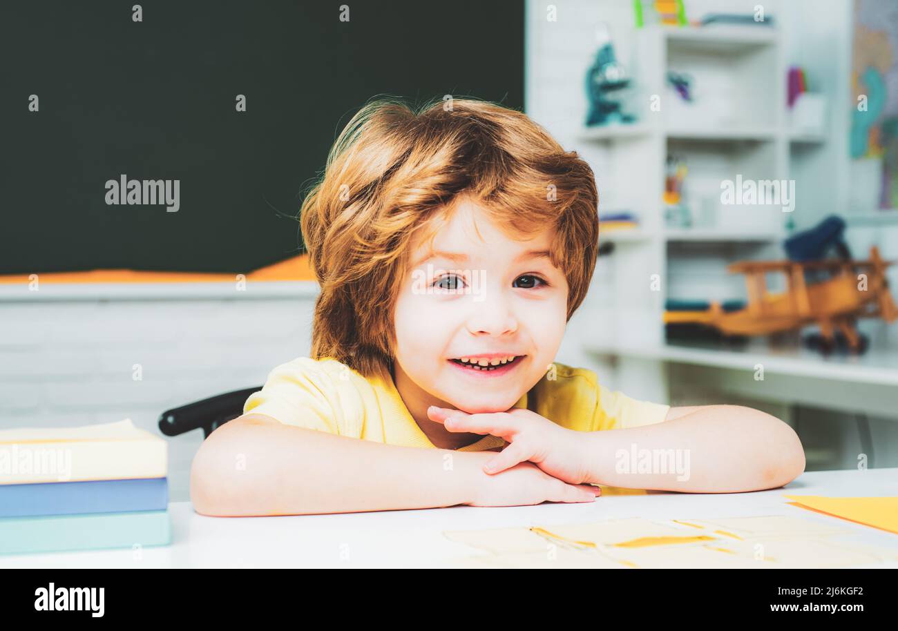 Cute little preschool kid boy with teacher study in a classroom Stock ...